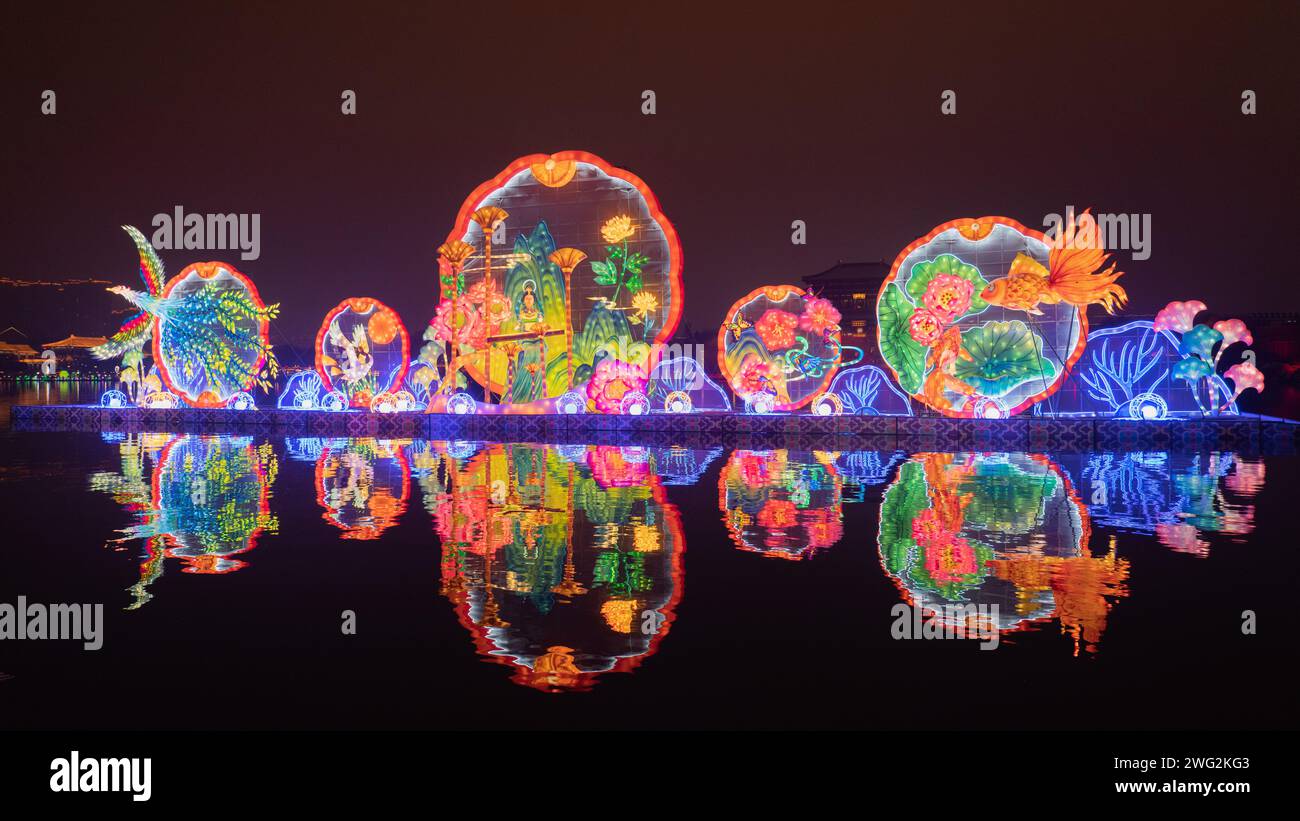XI'AN, CHINA - FEBRUARY 2, 2024 - Tourists enjoy colorful lights at ...