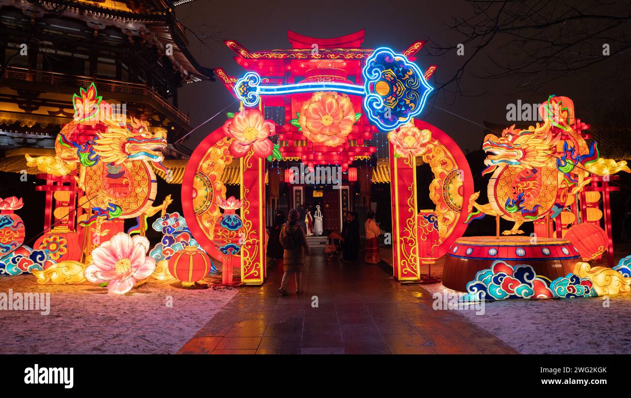 XI'AN, CHINA - FEBRUARY 2, 2024 - Tourists enjoy colorful lights at ...