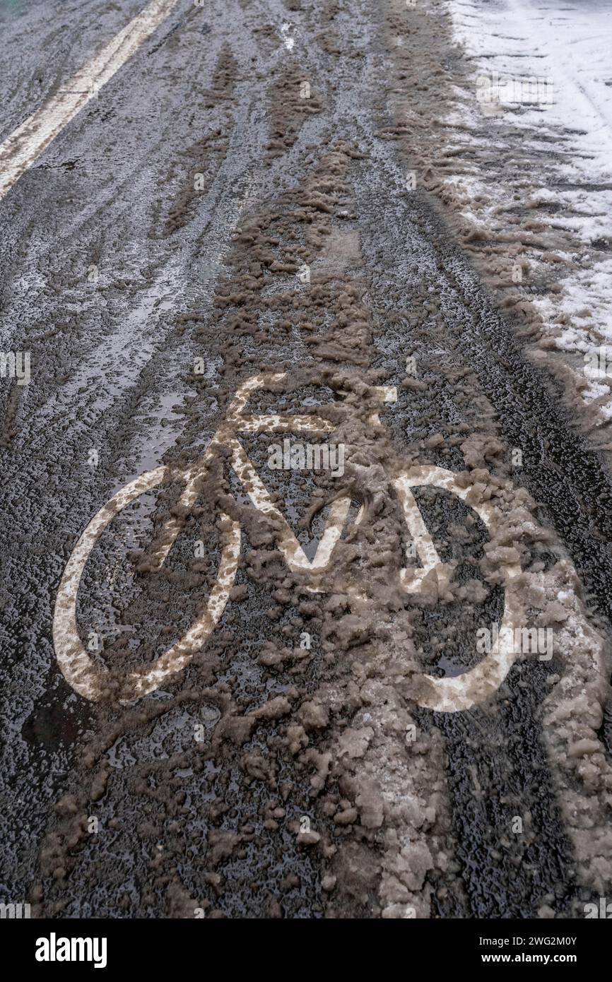 Onset of winter, poorly cleared bike lane, in the city center of ...