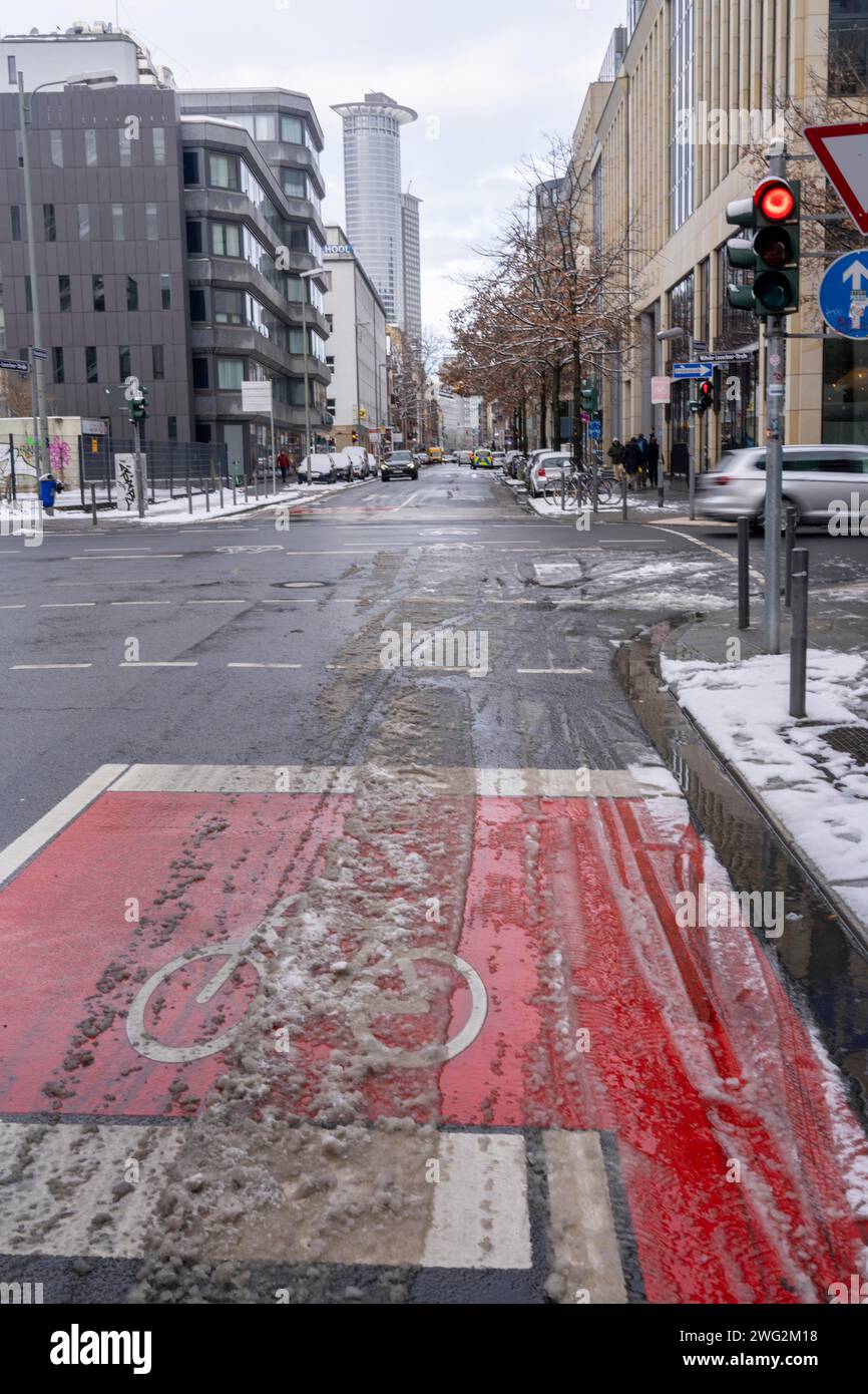 Onset of winter, poorly cleared bike lane, in the city center of ...