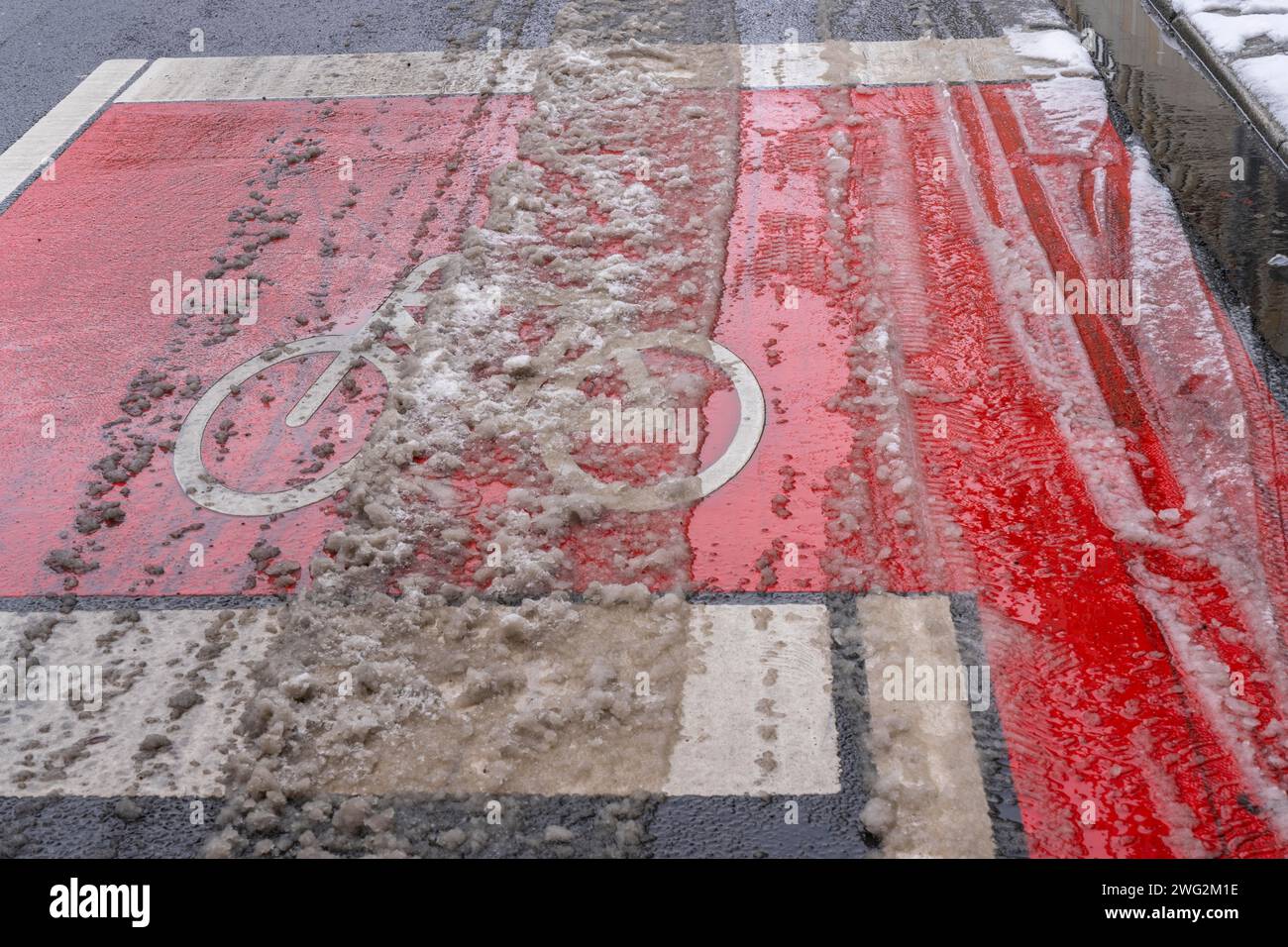 Onset of winter, poorly cleared bike lane, in the city center of ...