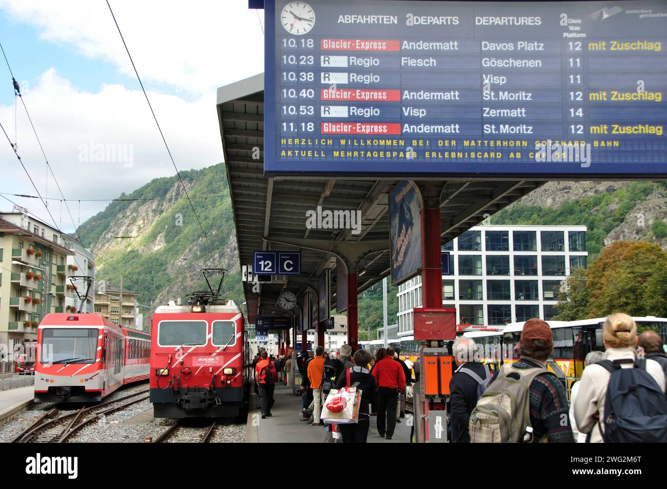 The glacier Express train is driving across the swiss alps and through ...