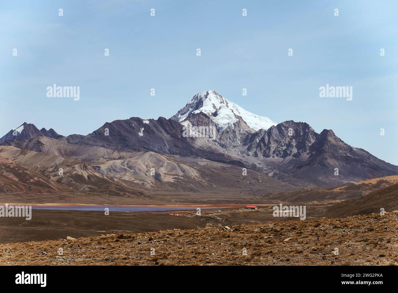 Mountain peak with snowy summit and clouds in the sky Stock Photo - Alamy