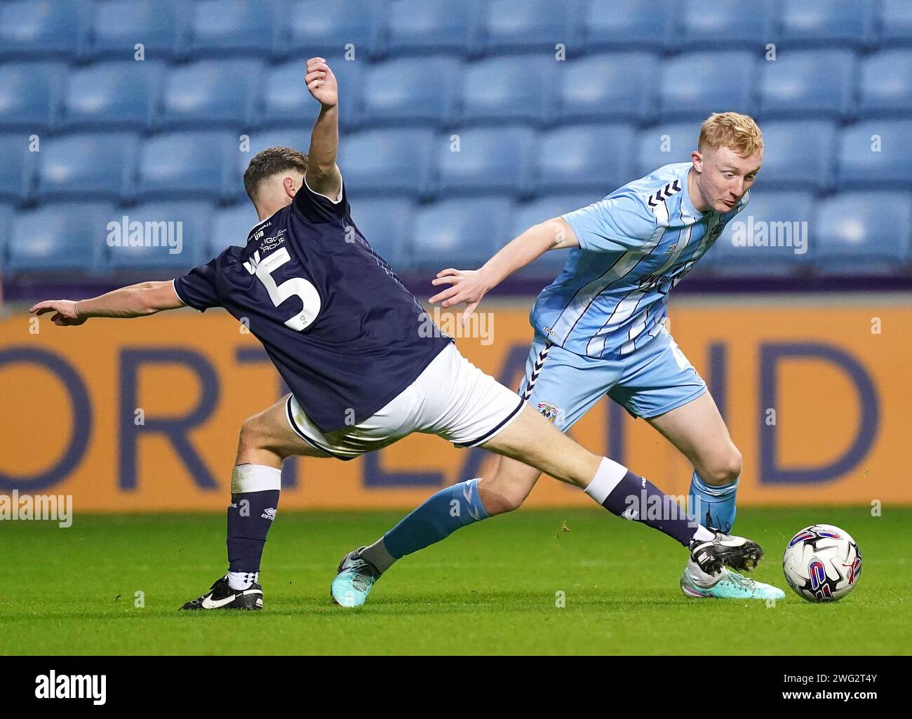Millwall's Harvey Whiteman (left) and Coventry City's David Mantle ...