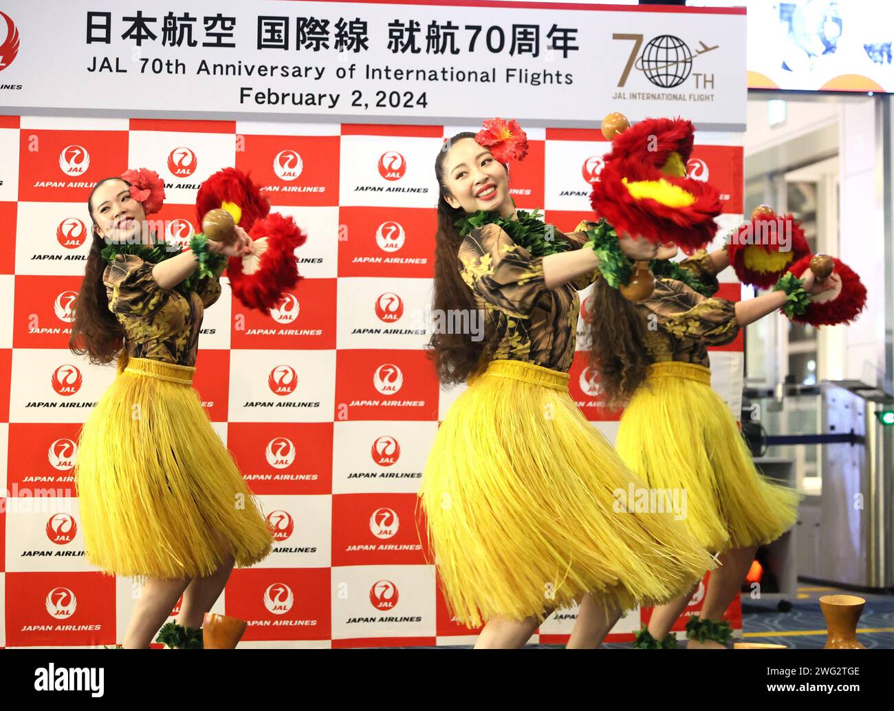 Tokyo, Japan. 2nd Feb, 2024. Japan Airlines (JAL) employee and hula ...