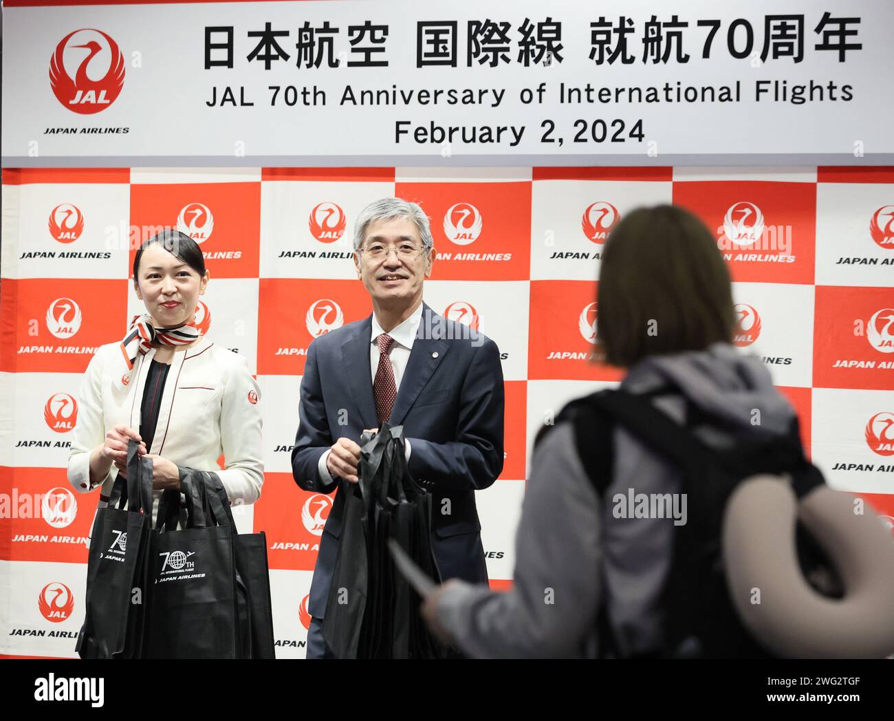 Tokyo, Japan. 2nd Feb, 2024. Japan Airlines (JAL) president Yuji Akasaka gives away small gifts ...
