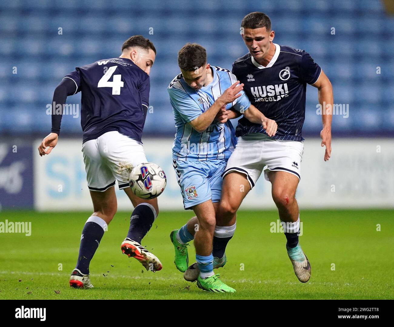 Coventry City's Elliot Betjemann (centre) tackled by Millwall's Alfie ...