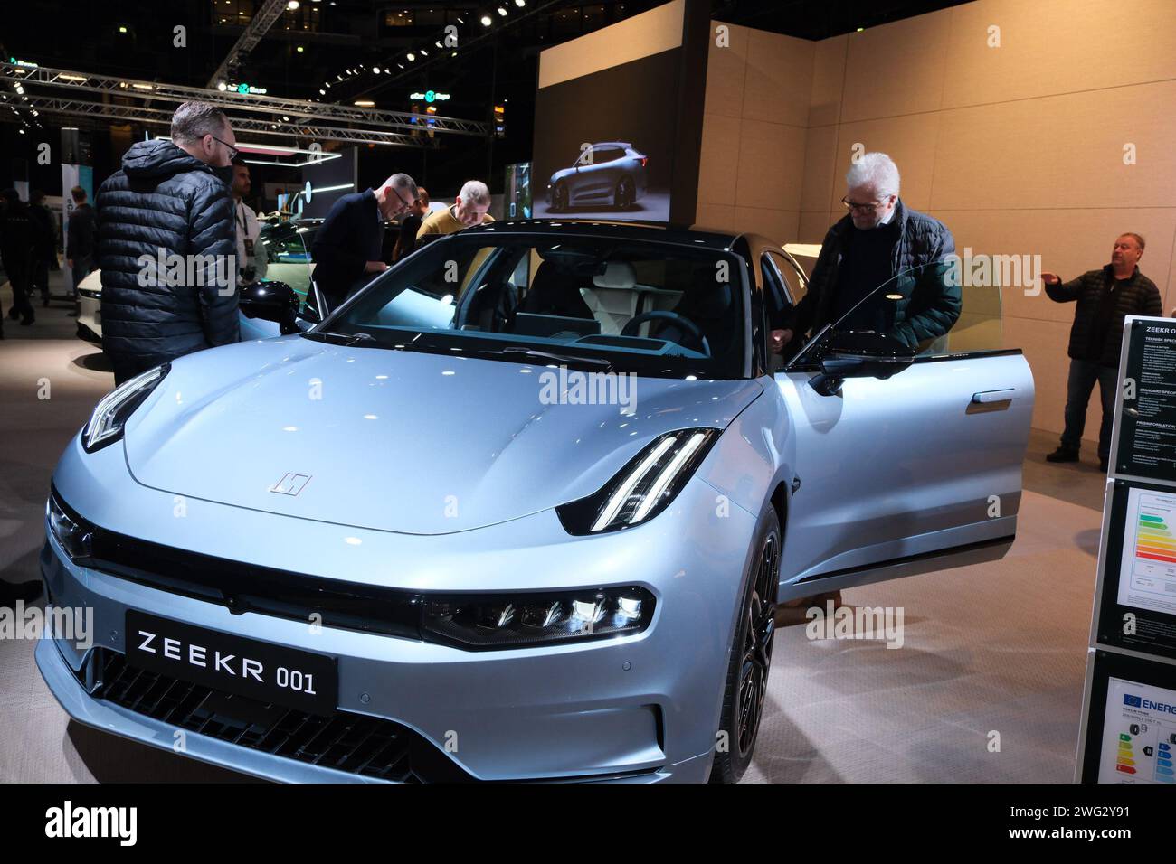 Stockholm, Sweden. 2nd Feb, 2024. People look at an electric vehicle of ...