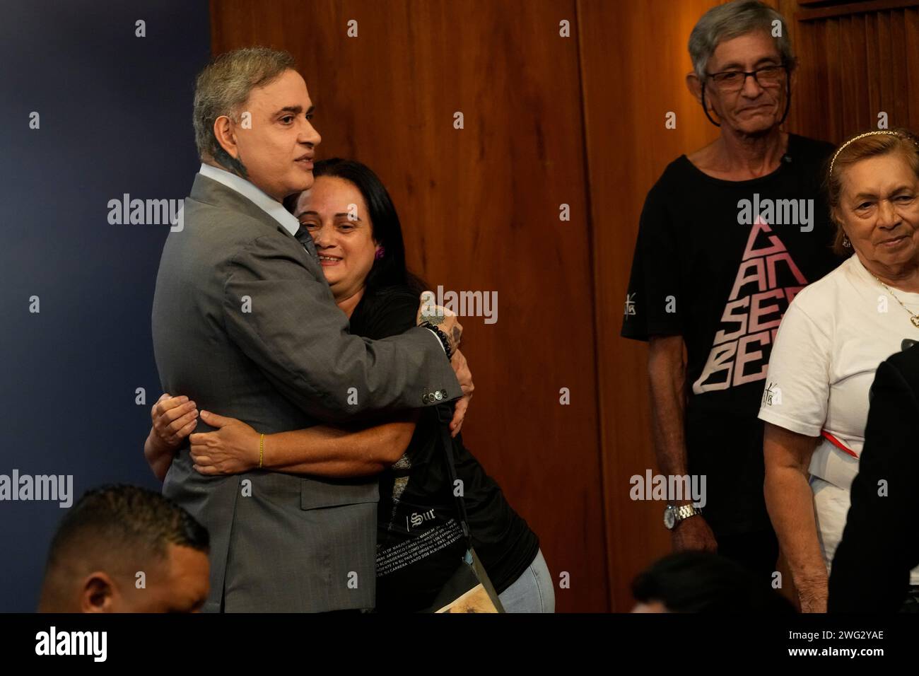 General Attorney Tarek William Saab, left, embraces Maria Ferrer Orama ...