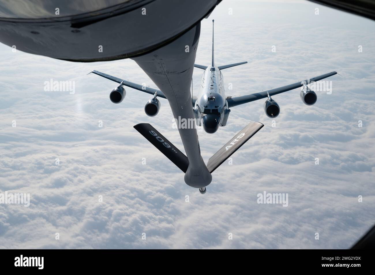 A U.S. Air Force RC-135 Rivet approaches a KC-135 for aerial refueling ...