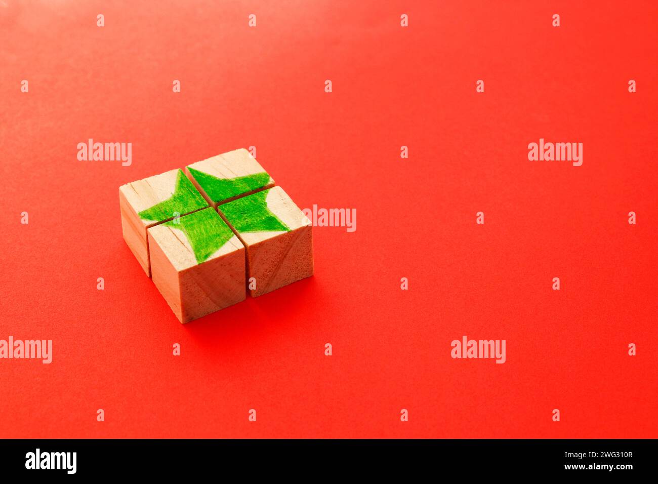 Wooden cube puzzle forming a star in its center Stock Photo - Alamy