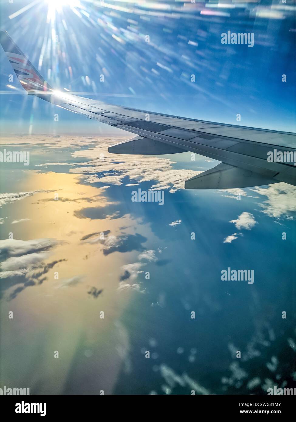 Aerial view from Santorini Island from a plane with window and airplane ...