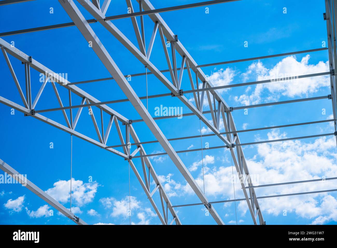 Steel beams and trusses of a warehouse under construction Stock Photo ...