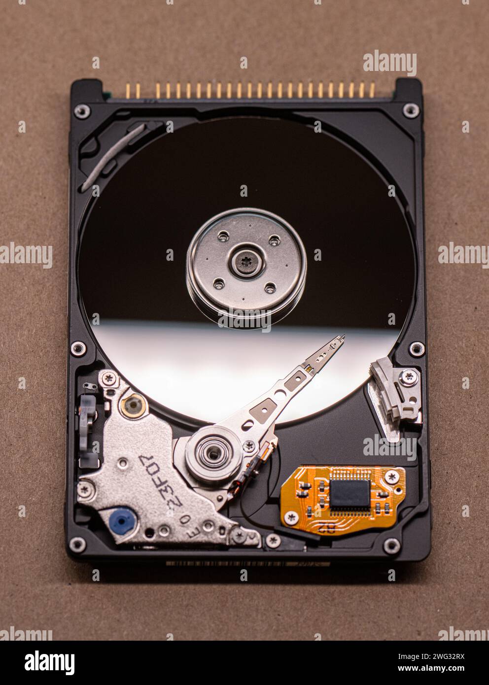 Mechanics inside a hard disk drive with platter and read write head ...