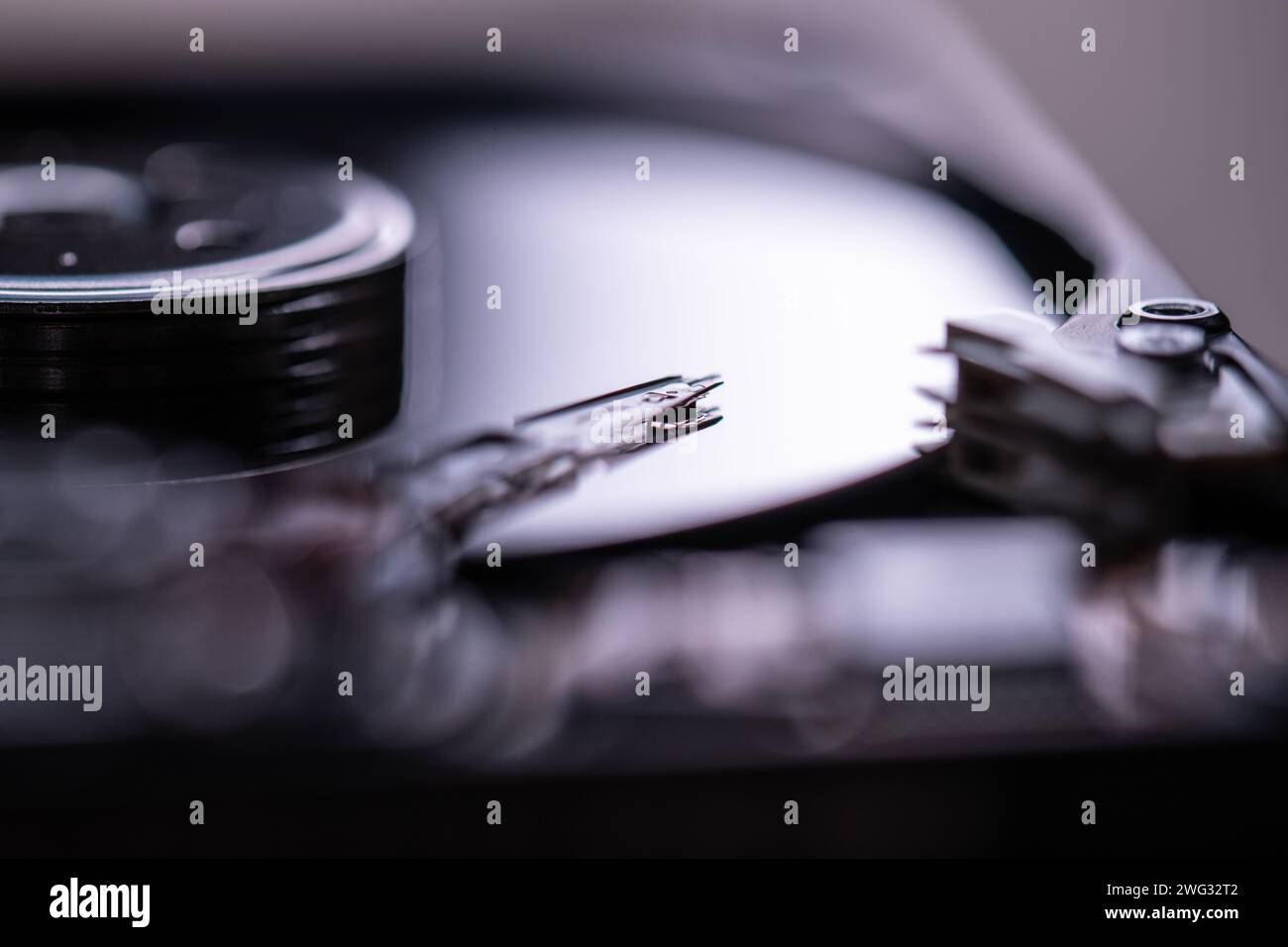 Mechanics inside a hard disk drive with platter and read write head ...