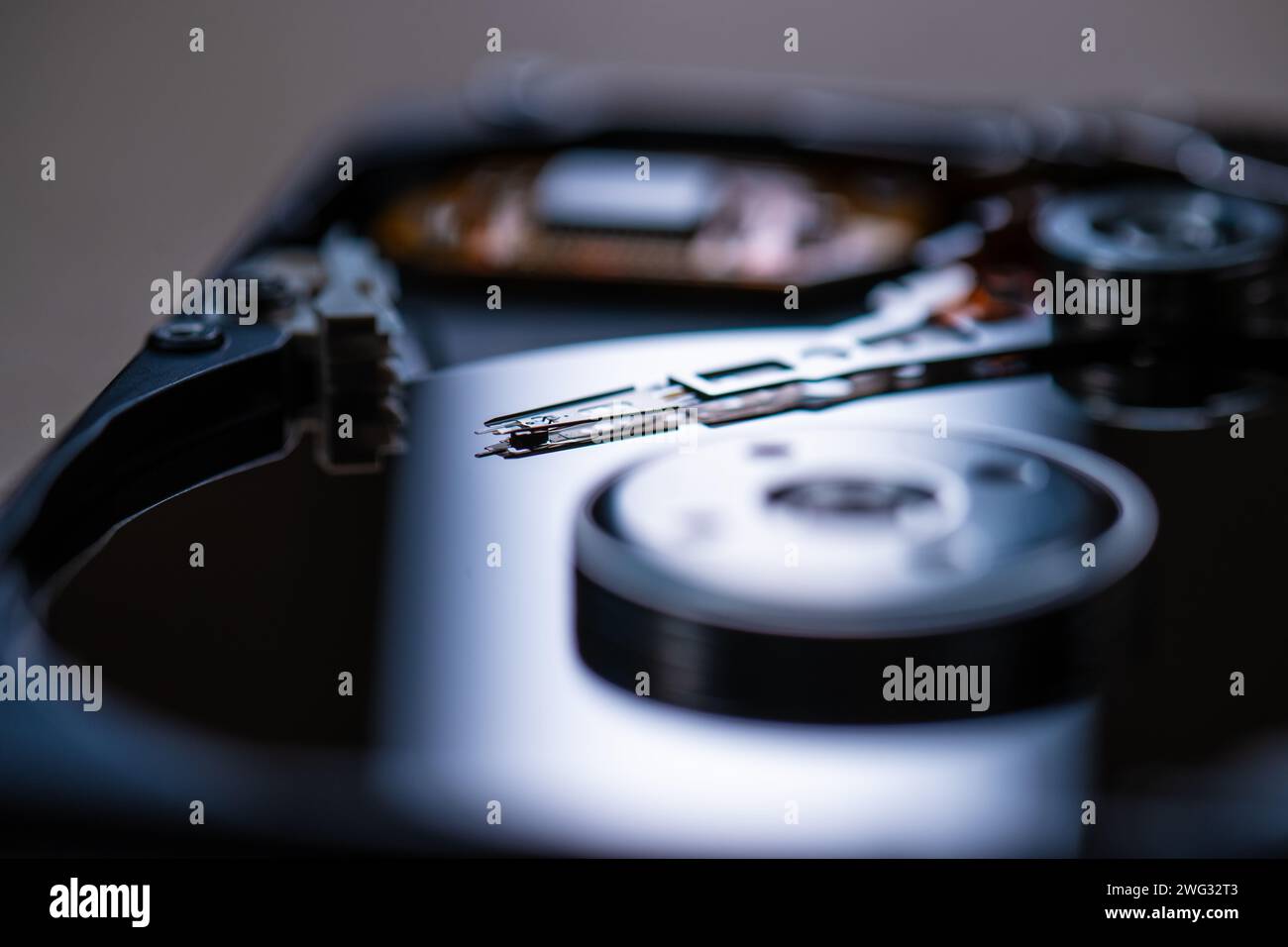 Mechanics inside a hard disk drive with platter and read write head ...