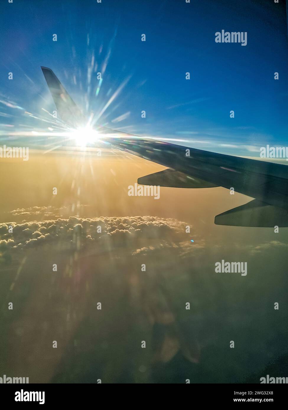 Aerial view from Santorini Island from a plane with window and airplane ...