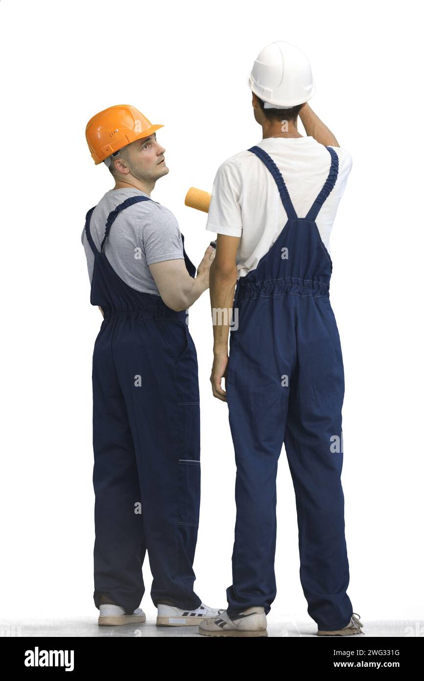 Two builders, on a white background, in full height Stock Photo - Alamy