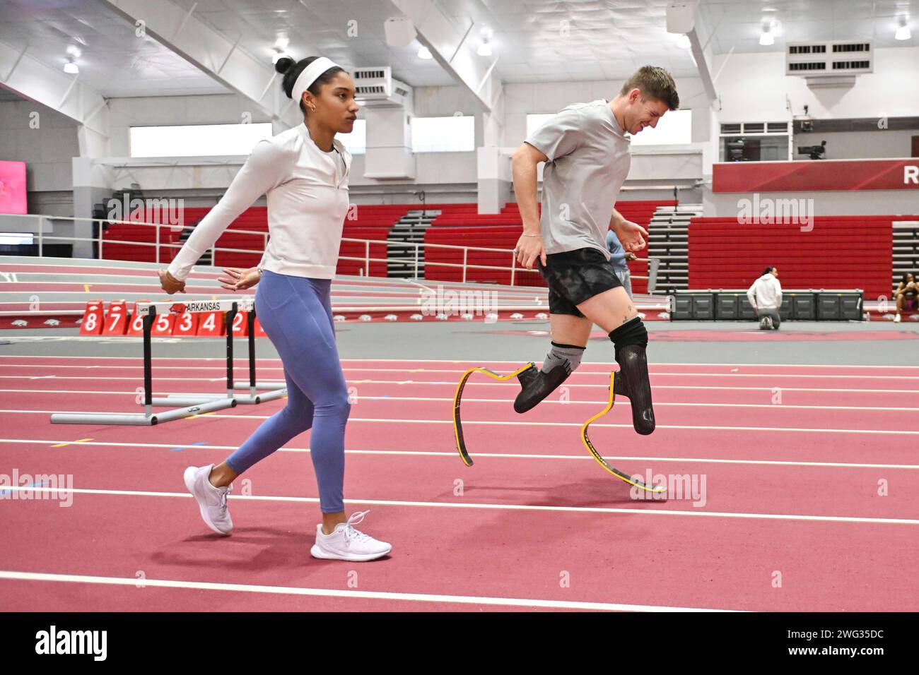 Olympic long jumper Tara Davis-Woodhall, left, works out with her ...