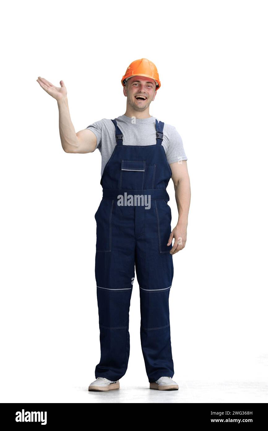 A builder, on a white background, in full height, waving his hand Stock ...