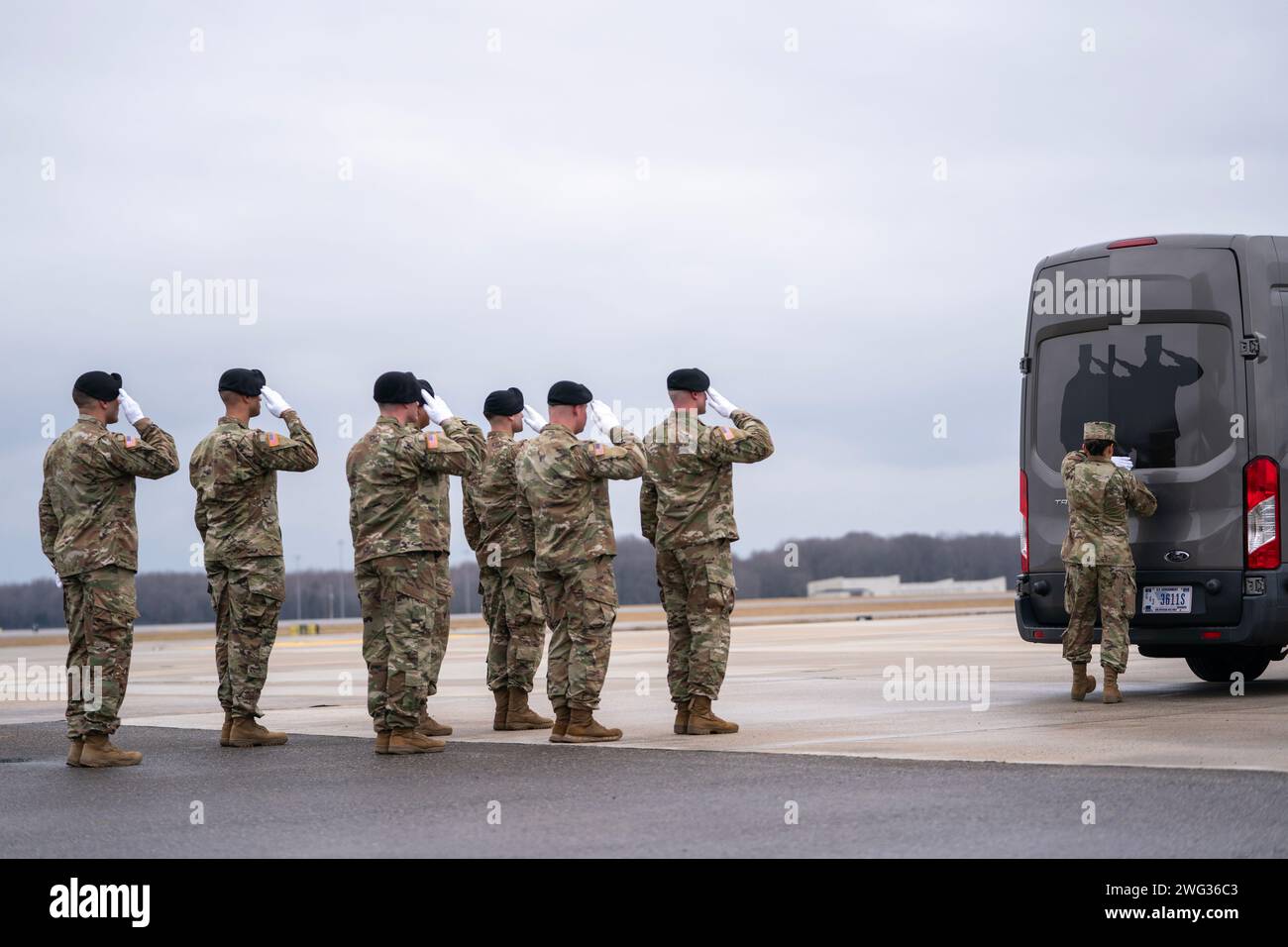 Dover, USA. 02nd Feb, 2024. A U.S. Army carry team salutes flag draped ...