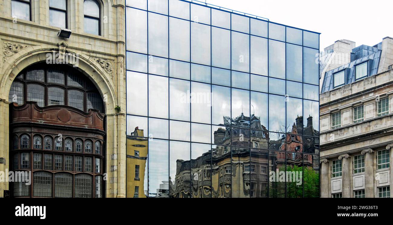 Cityscape buildings reflected in a sleek glass building facade Stock ...