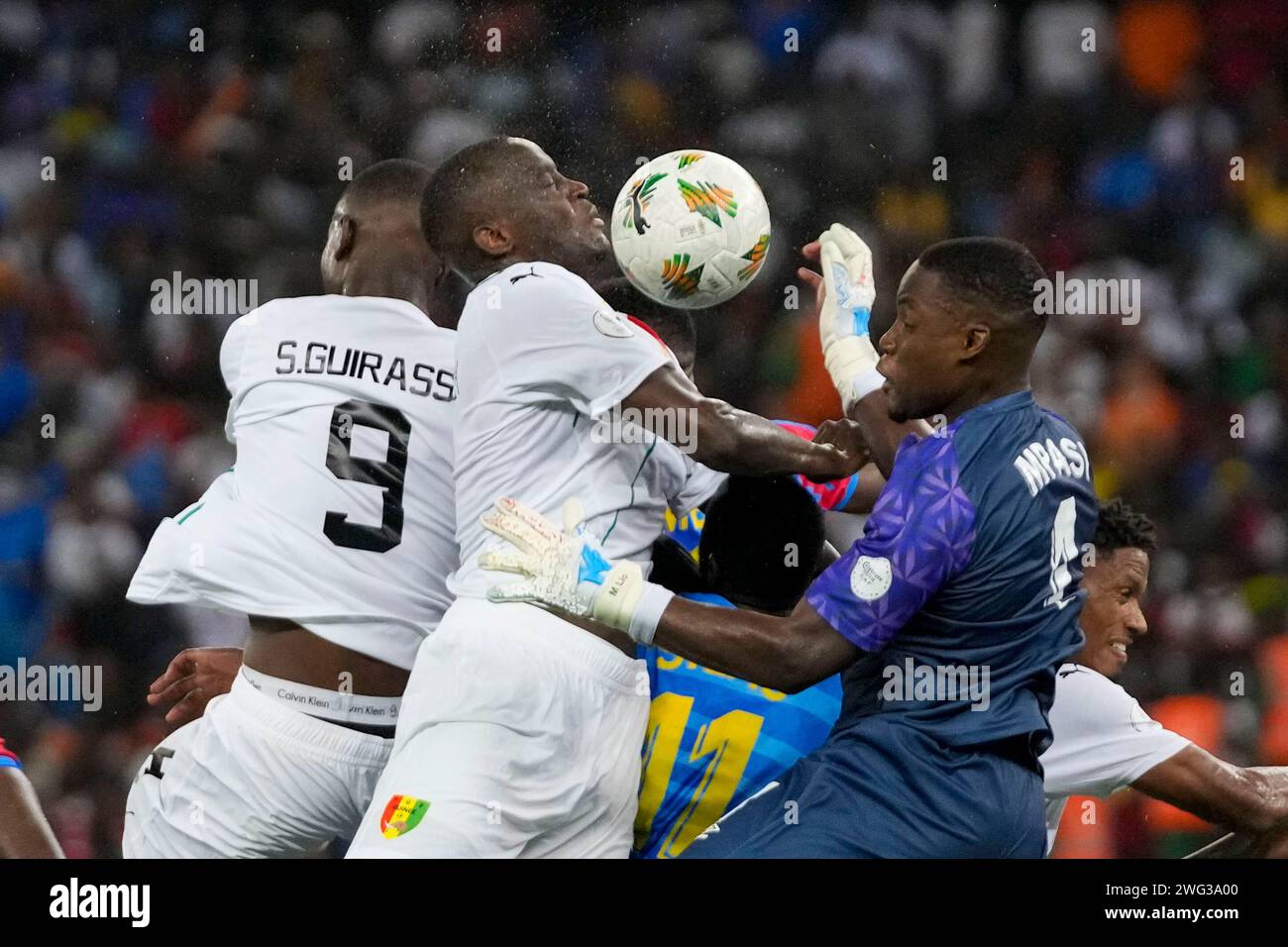 DR Congo's goalkeeper Lionel M'Pasi N'Zau, right, makes a save in front ...