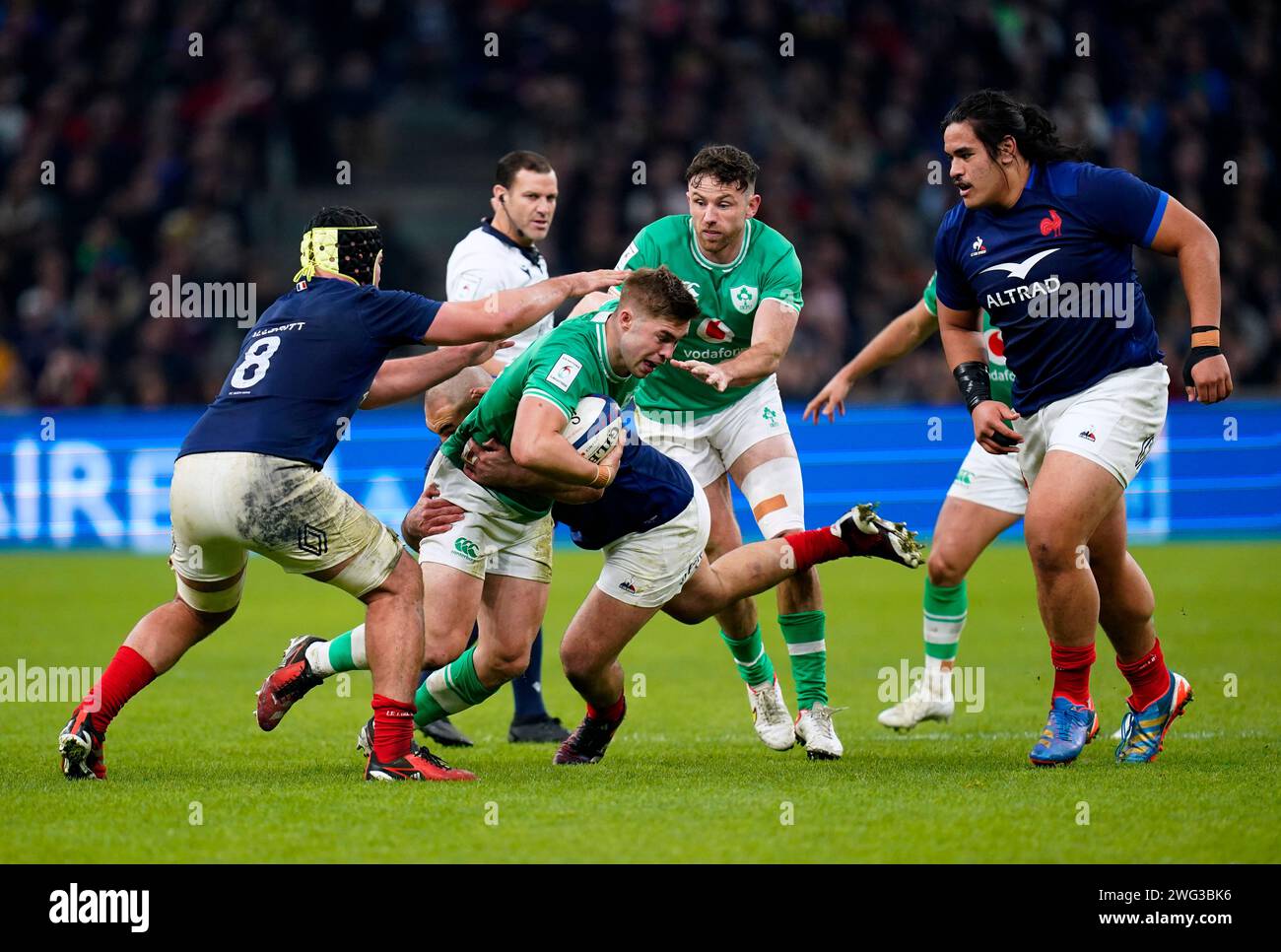 Ireland's Jack Crowley is tackled by France's Reda Wardi and Gregory ...