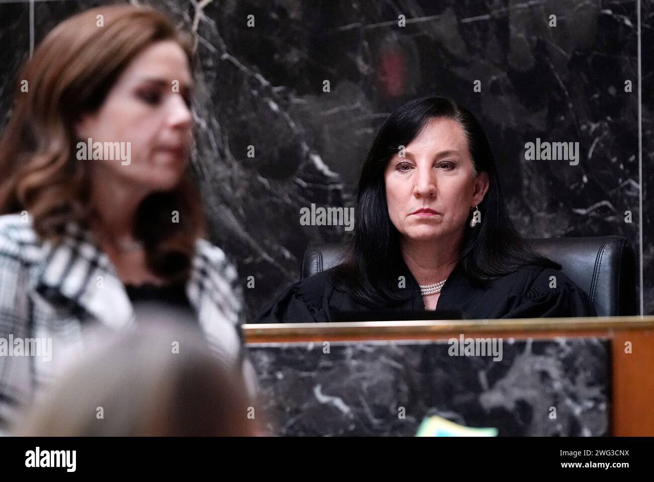 Judge Cheryl Matthews presides as defense attorney Shannon Smith gives ...