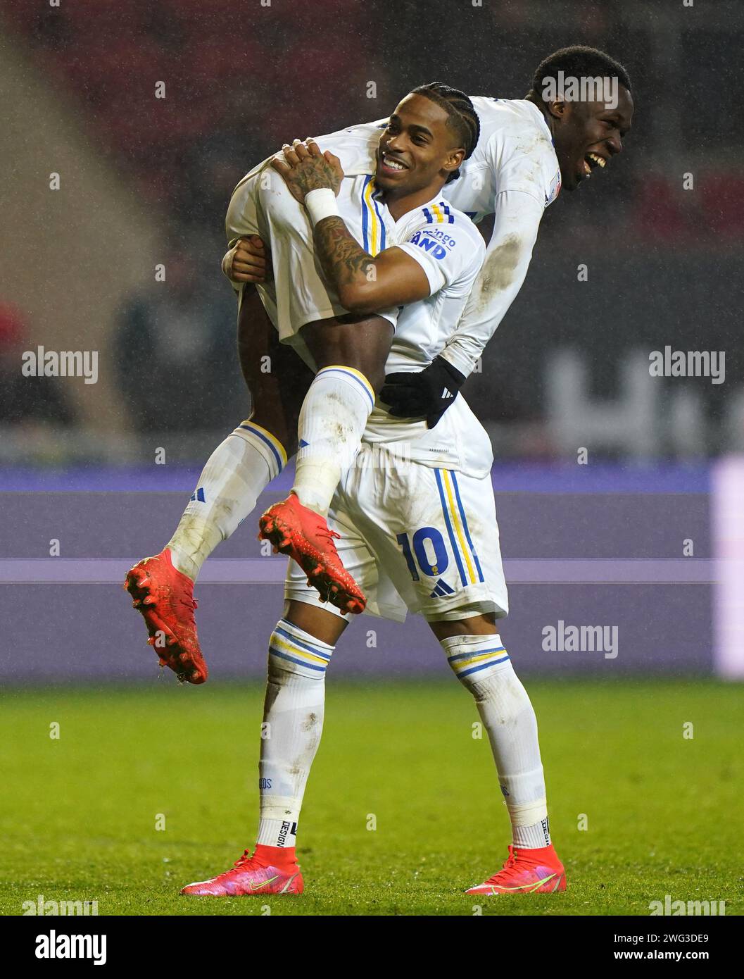 Leeds United's Crysencio Summerville carries Leeds United's Wilfried ...