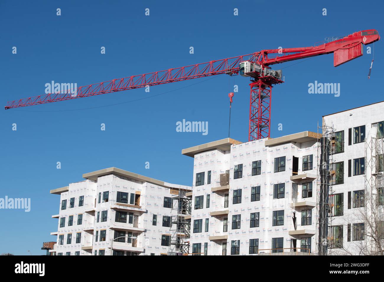 Cranes used during construction of large apartment and condominium ...