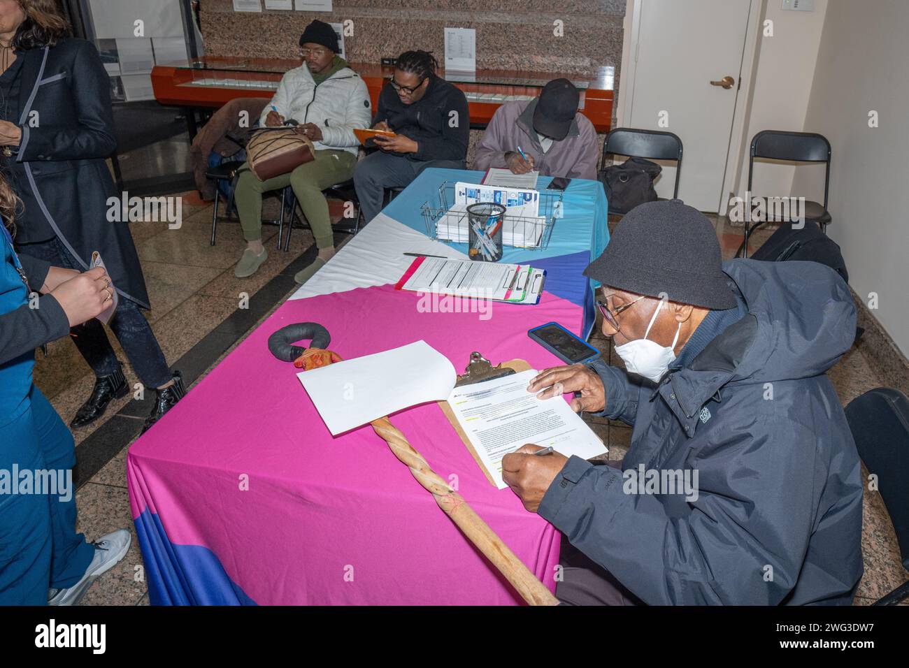 Men filling out the paperwork prior to the test at The Blue Jacket Show ...