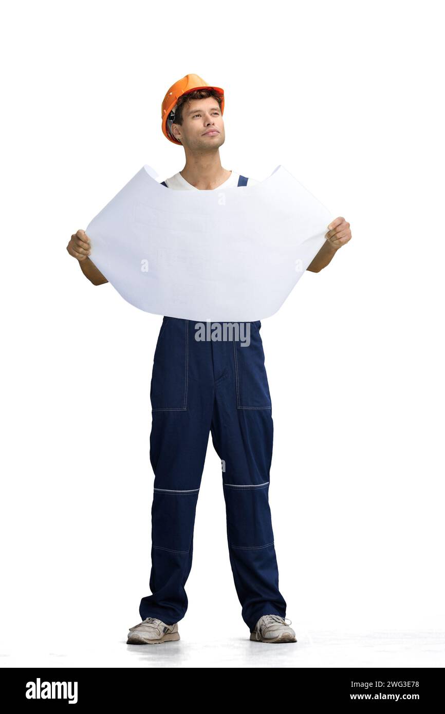 A male builder, on a white background, full-length, with a drawing ...