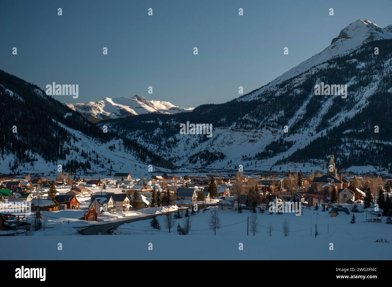 The last rays of sun fall on Silverton, Colorado on a fine winter day ...