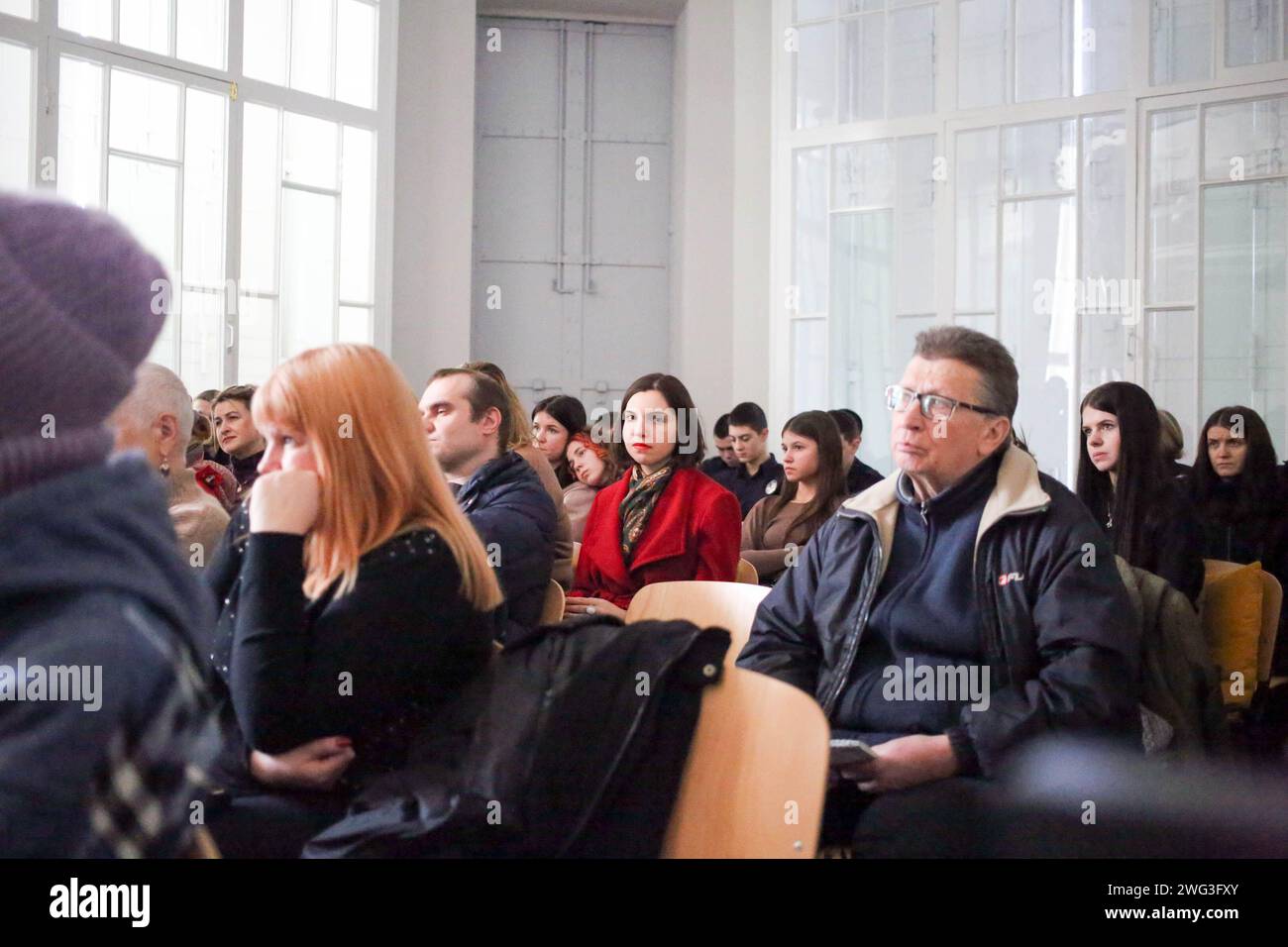 Audience listen to music at a memorial evening of Andriy Kuzmenko. An evening in memory of ...