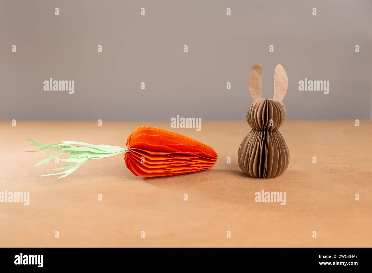 orange paper carrot craft next to recycled paper bunny rabbit Stock ...