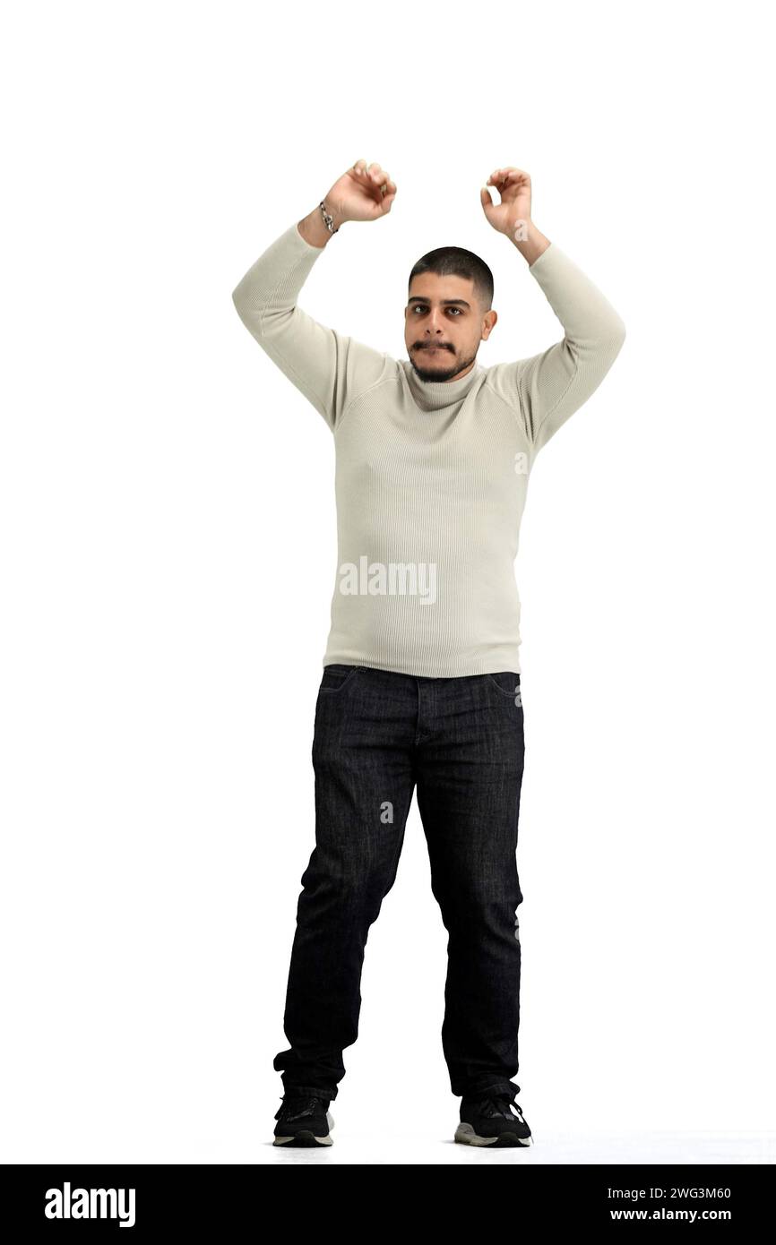 A man, full-length, on a white background, raised his hands up Stock ...