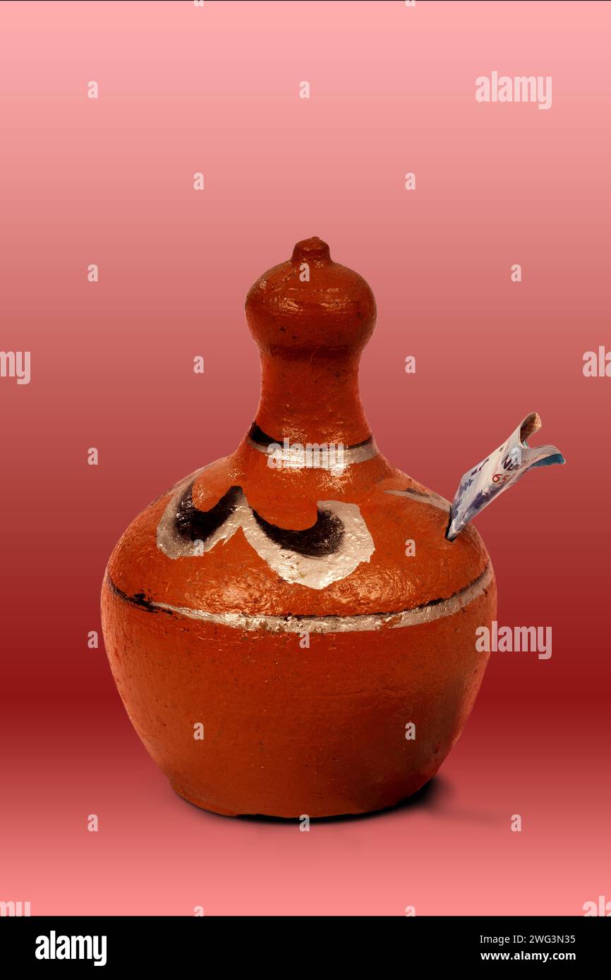 piggy bank made of clay in red background, isolated Stock Photo - Alamy
