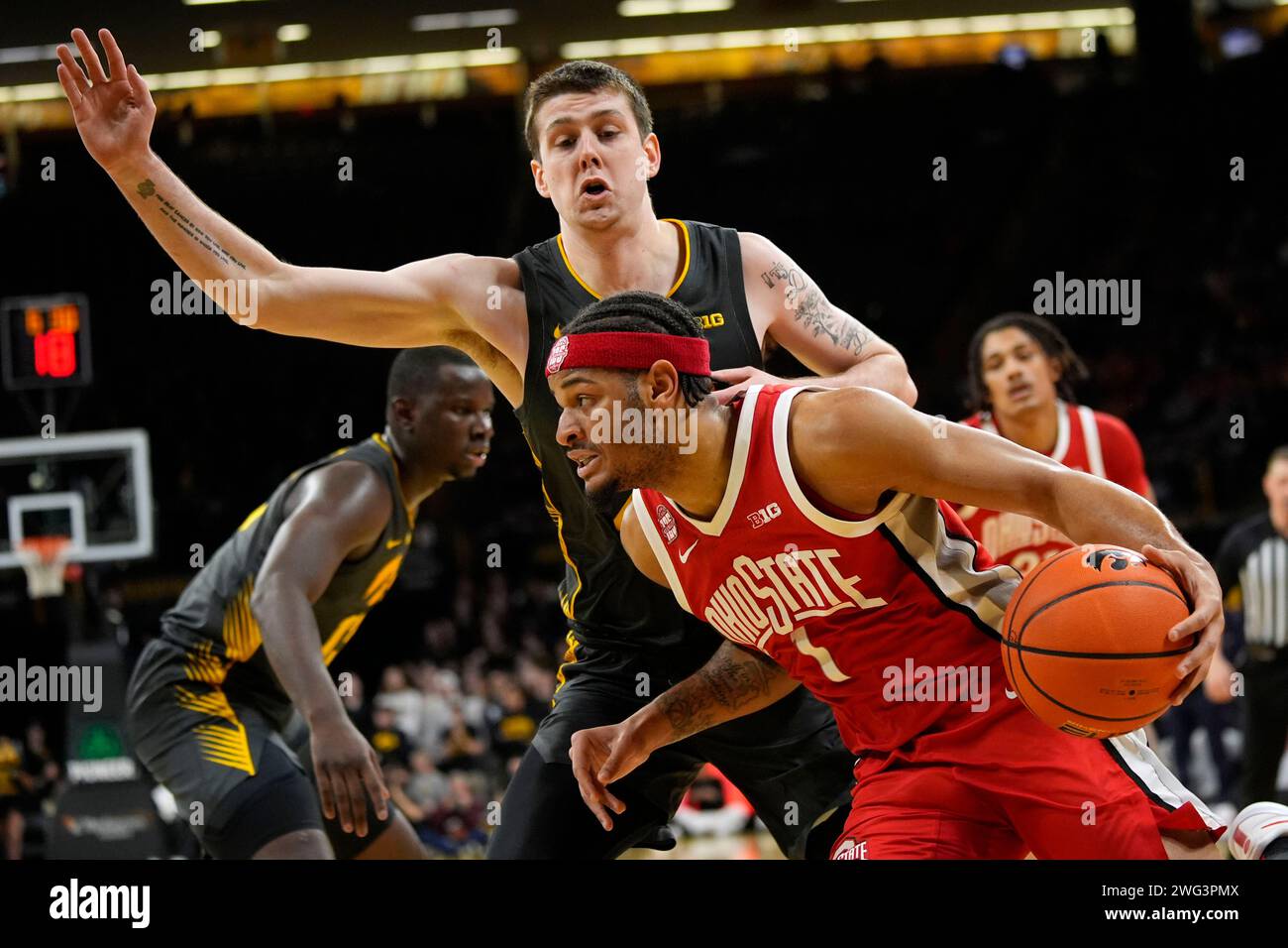 Ohio State guard Roddy Gayle Jr. (1) drives past Iowa forward Patrick ...