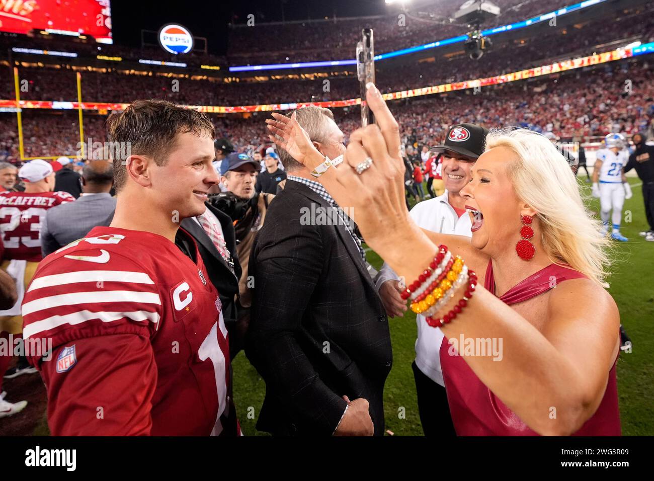 San Francisco 49ers quarterback Brock Purdy, left, hugs his mother ...
