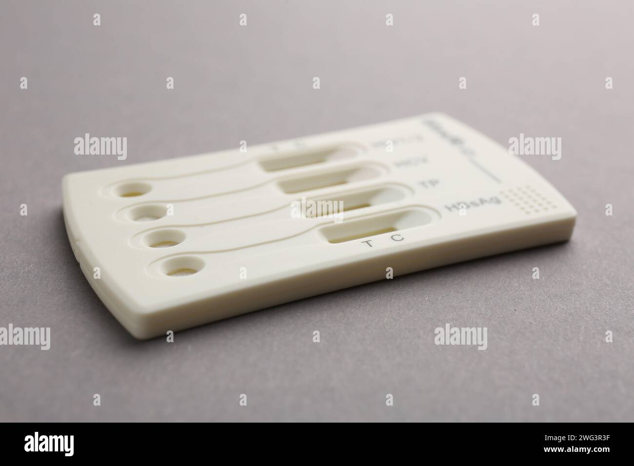 Disposable multi-infection express test on light grey background ...