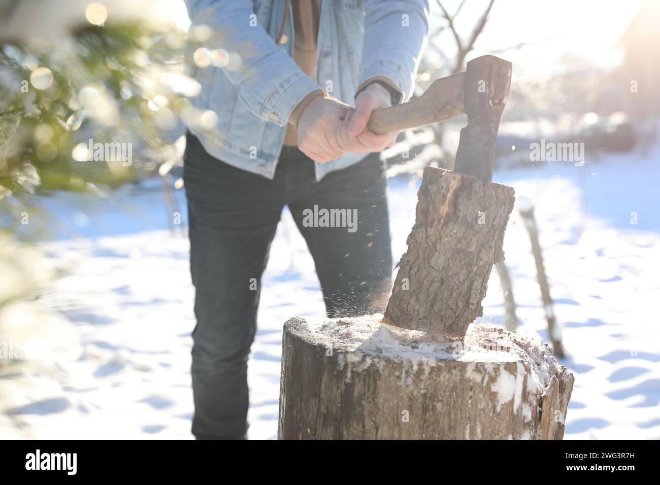 Man chopping wood with axe outdoors on winter day, closeup Stock Photo ...