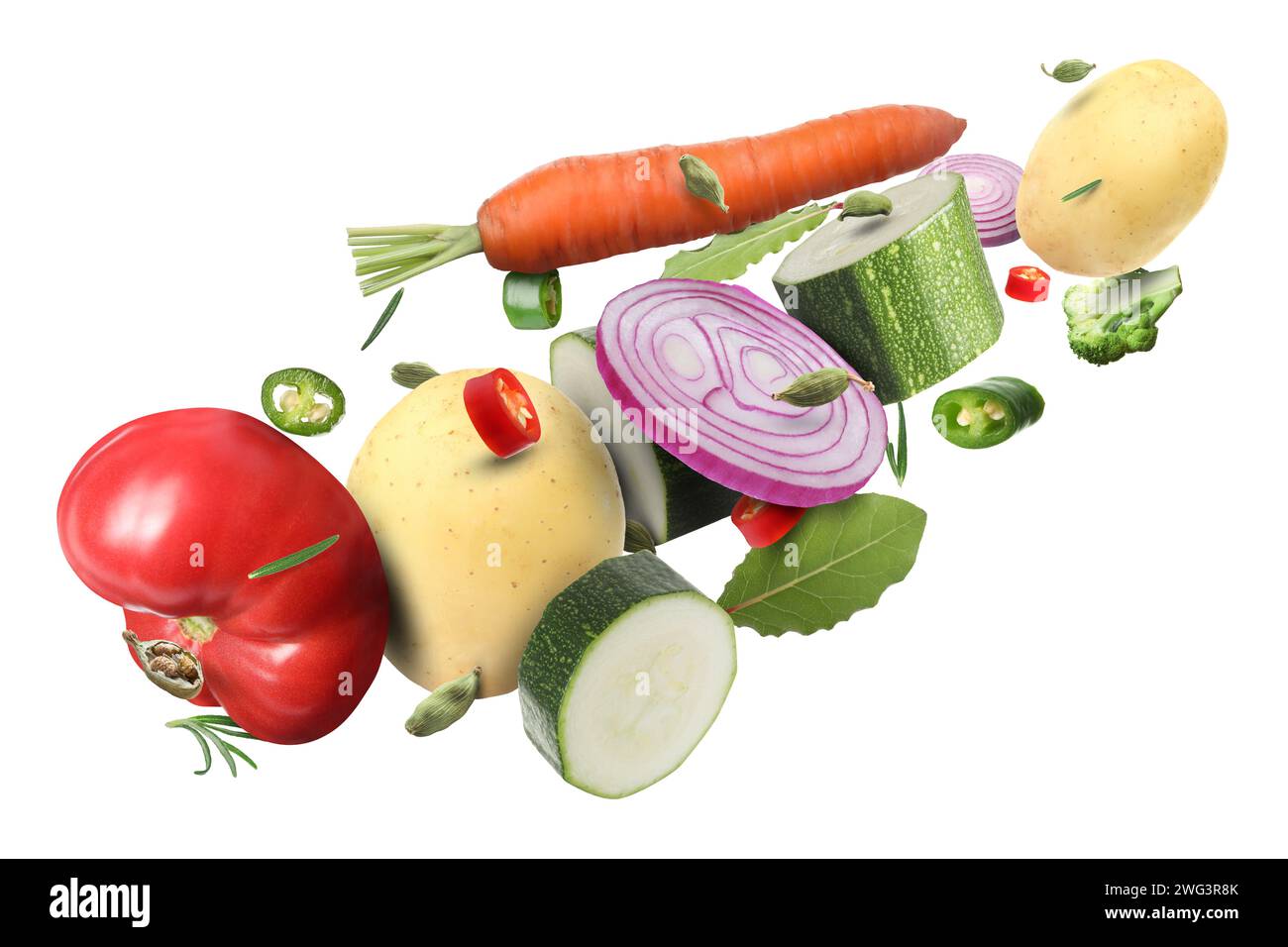 Different fresh vegetables and spices in air on white background Stock ...