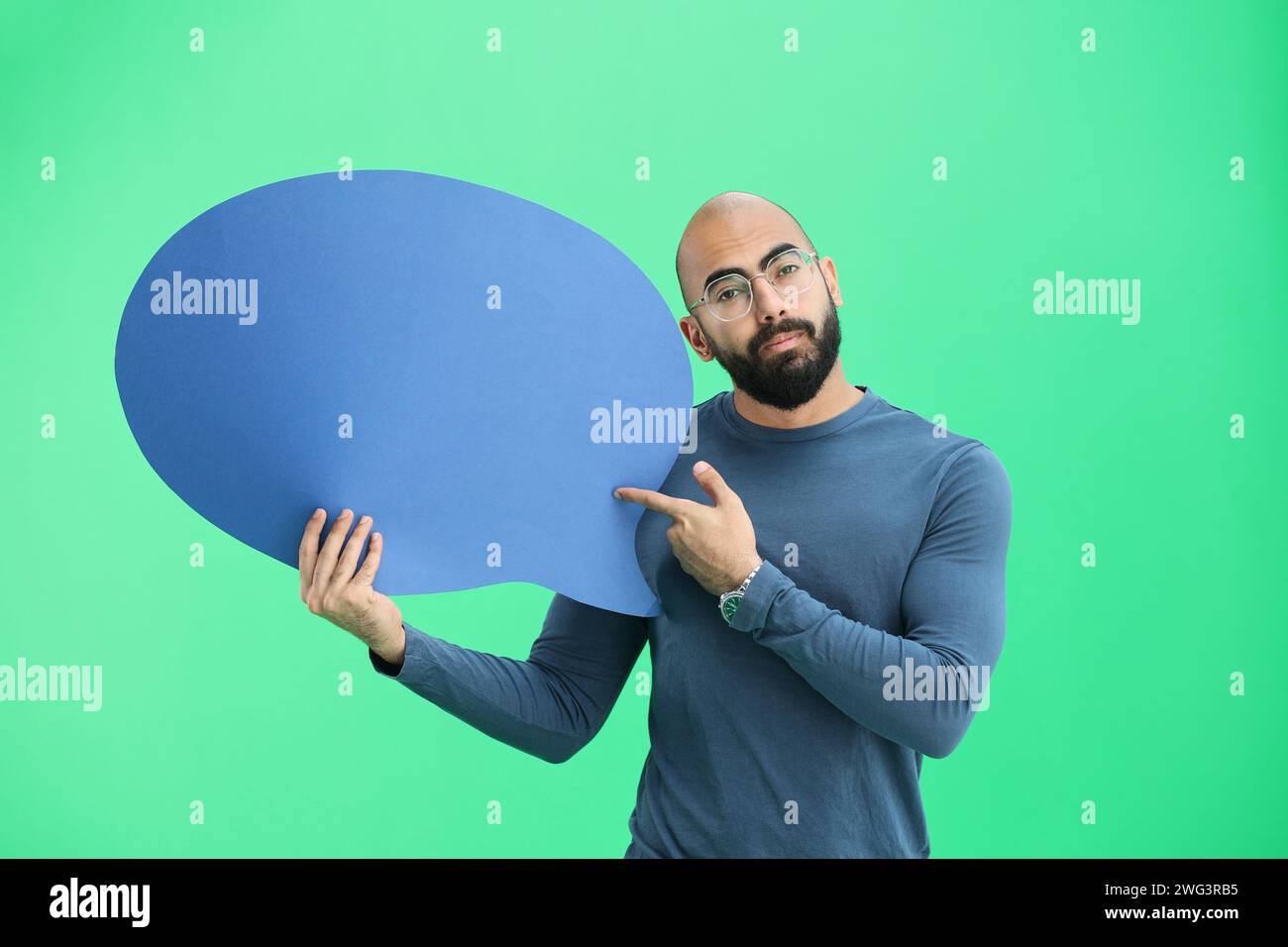 Man, on a green background, close-up, with a blue comment sign Stock ...