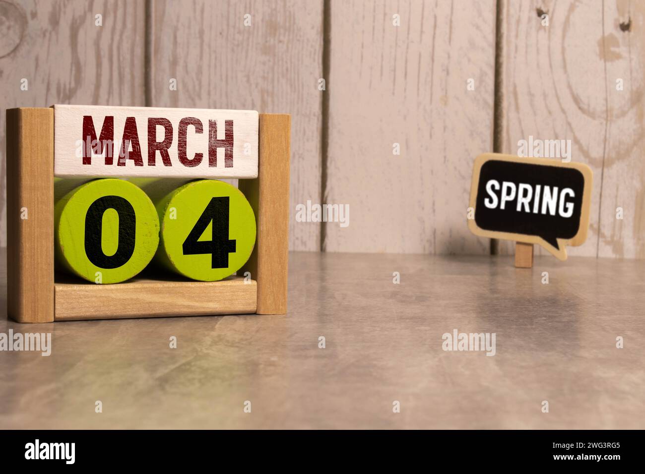 March 4 calendar date text on wooden blocks with blurred park ...