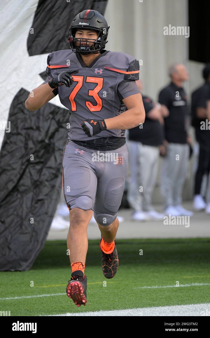 Team Fire offensive lineman Rustin Young (73) runs onto the field ...
