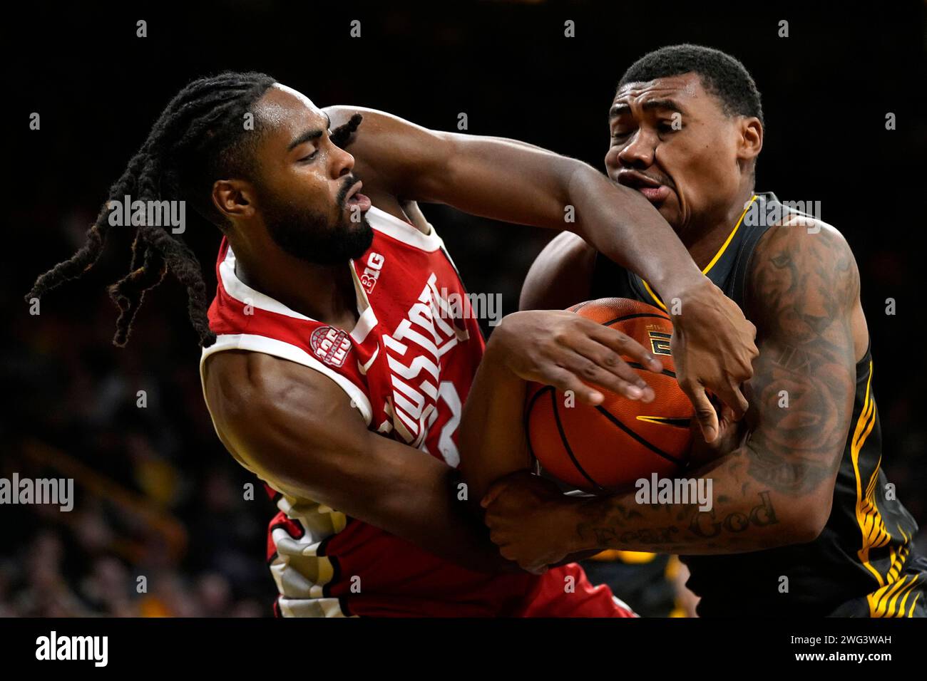 Ohio State guard Evan Mahaffey, left, fights for a rebound with Iowa ...