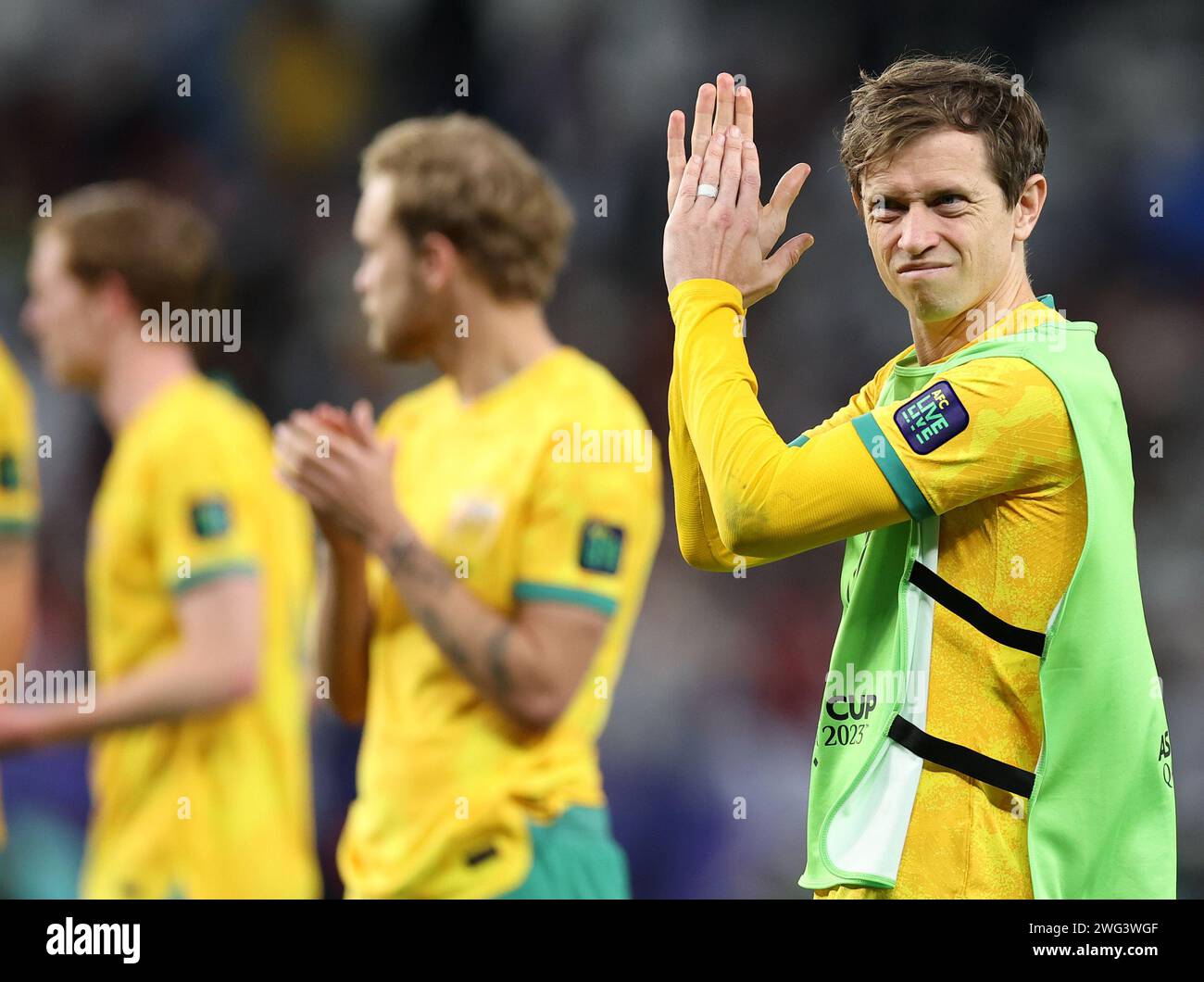Doha, Qatar. 2nd Feb, 2024. Australia's Craig Goodwin (front) applauds ...