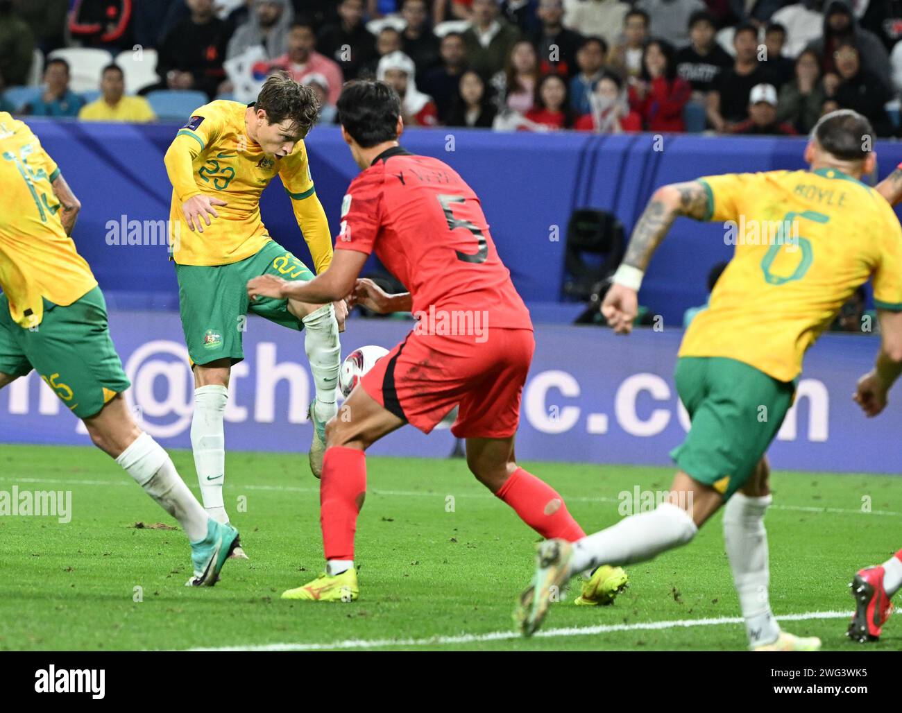 Doha, Qatar. 2nd Feb, 2024. Australia's Craig Goodwin (2nd L) shoots to ...