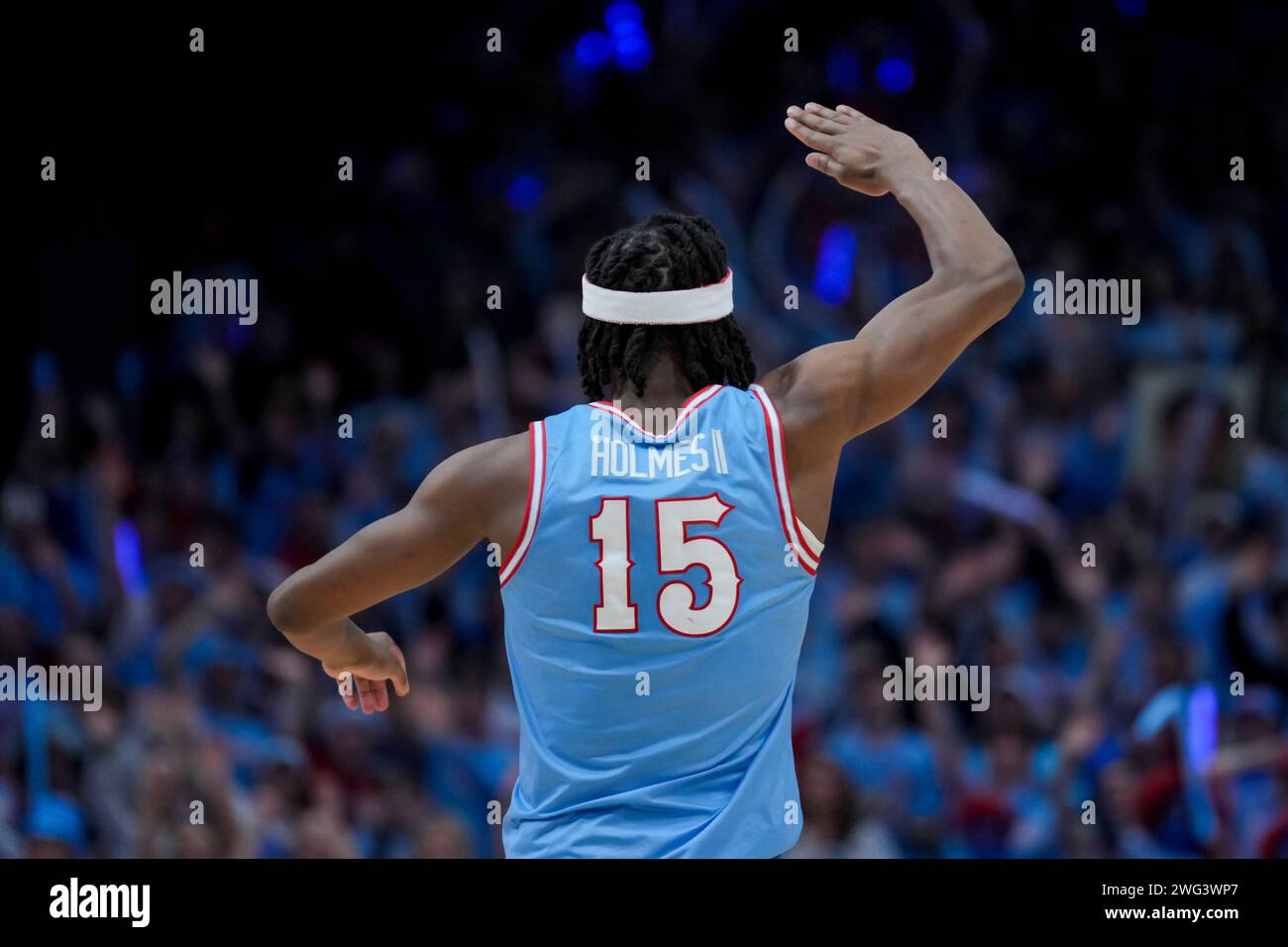 Dayton forward DaRon Holmes II salutes the crowd after making a basket ...